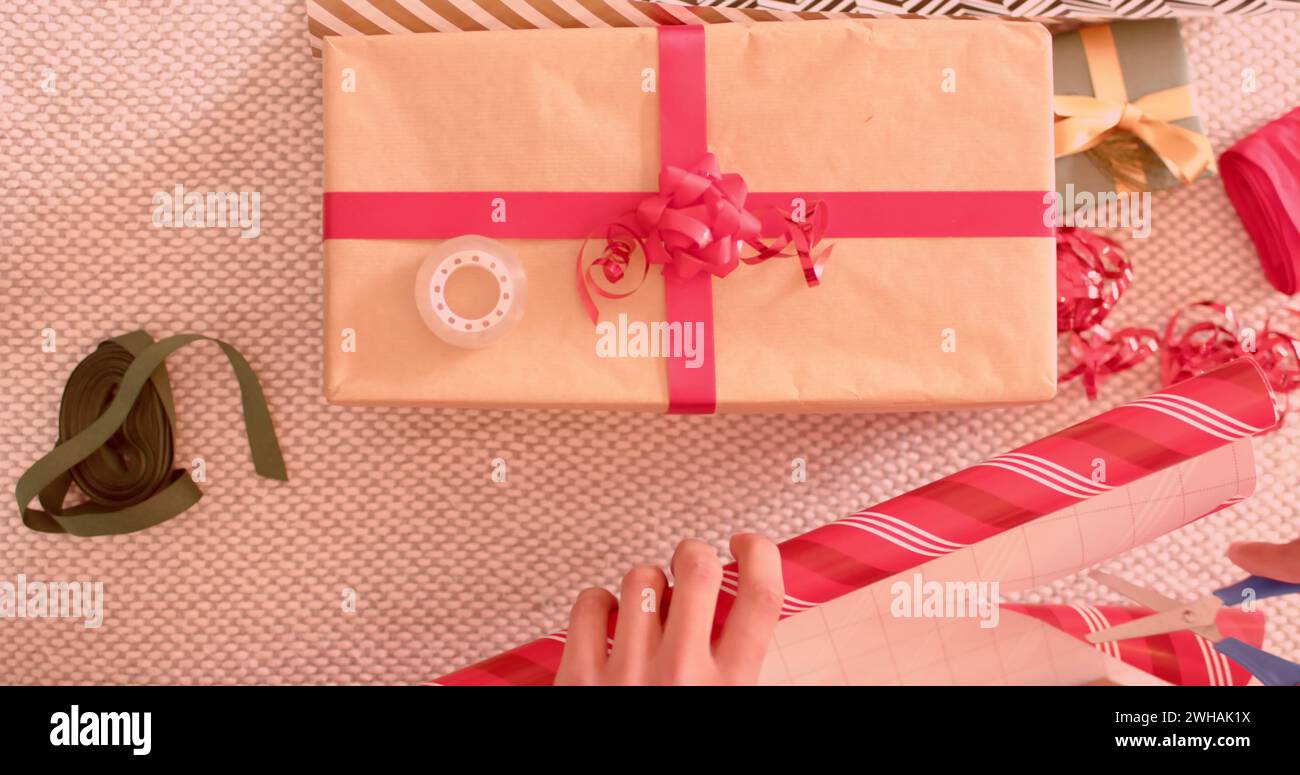 Hands prepare a gift on a festive background, with copy space Stock ...