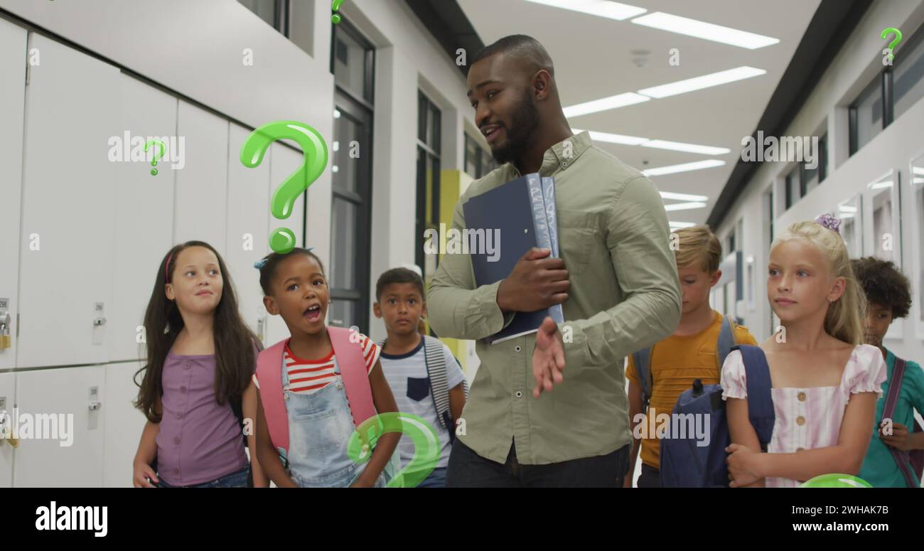 Image of green question marks over happy african american male teacher ...