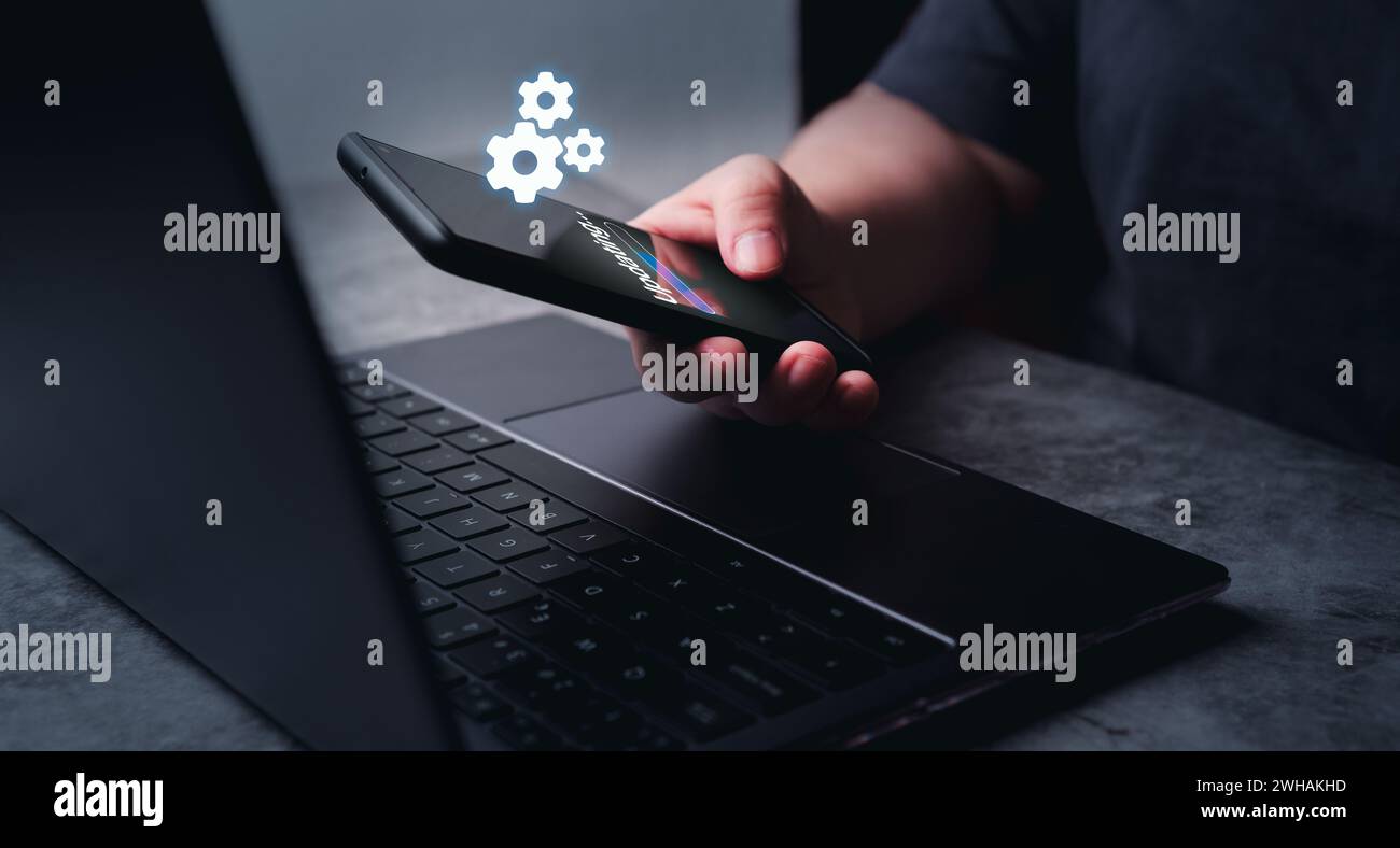 Woman updating system on smartphone. Software engineer and programming ...