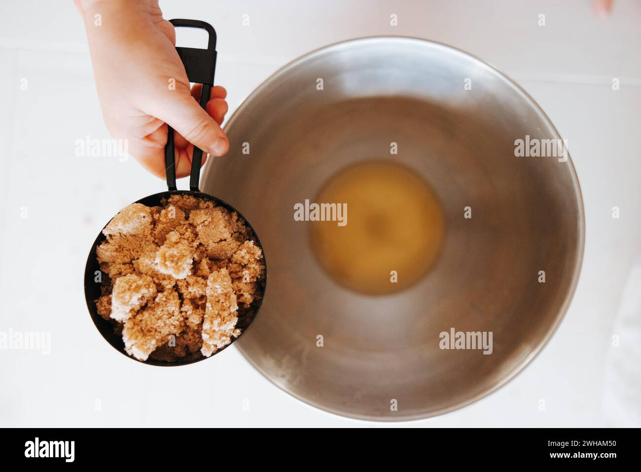 Little girl ready to dump sugar, culinary fun Stock Photo - Alamy
