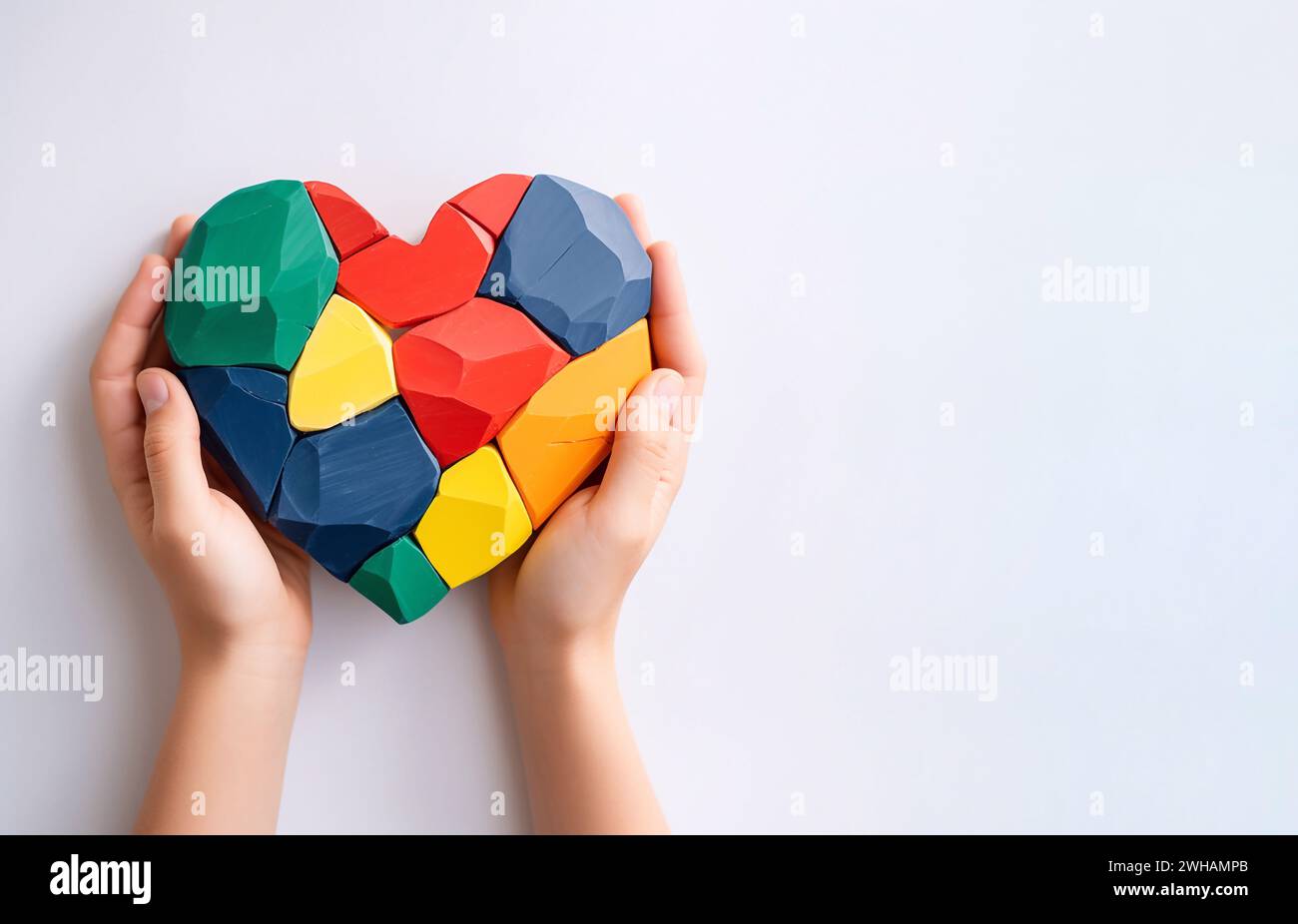 Child's hands holding a heart on white background with copyspace. World ...
