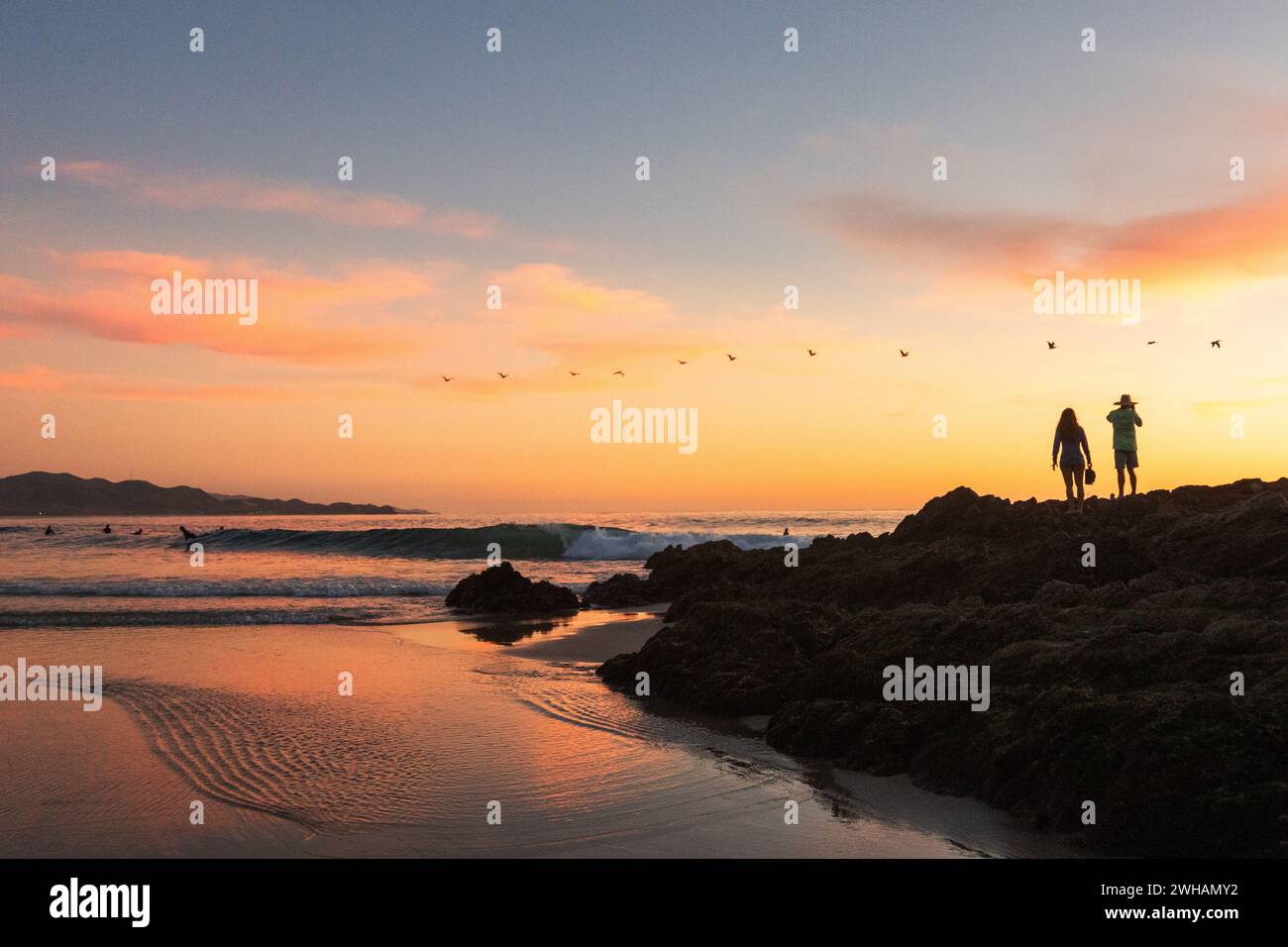 Two people stand hi-res stock photography and images - Alamy