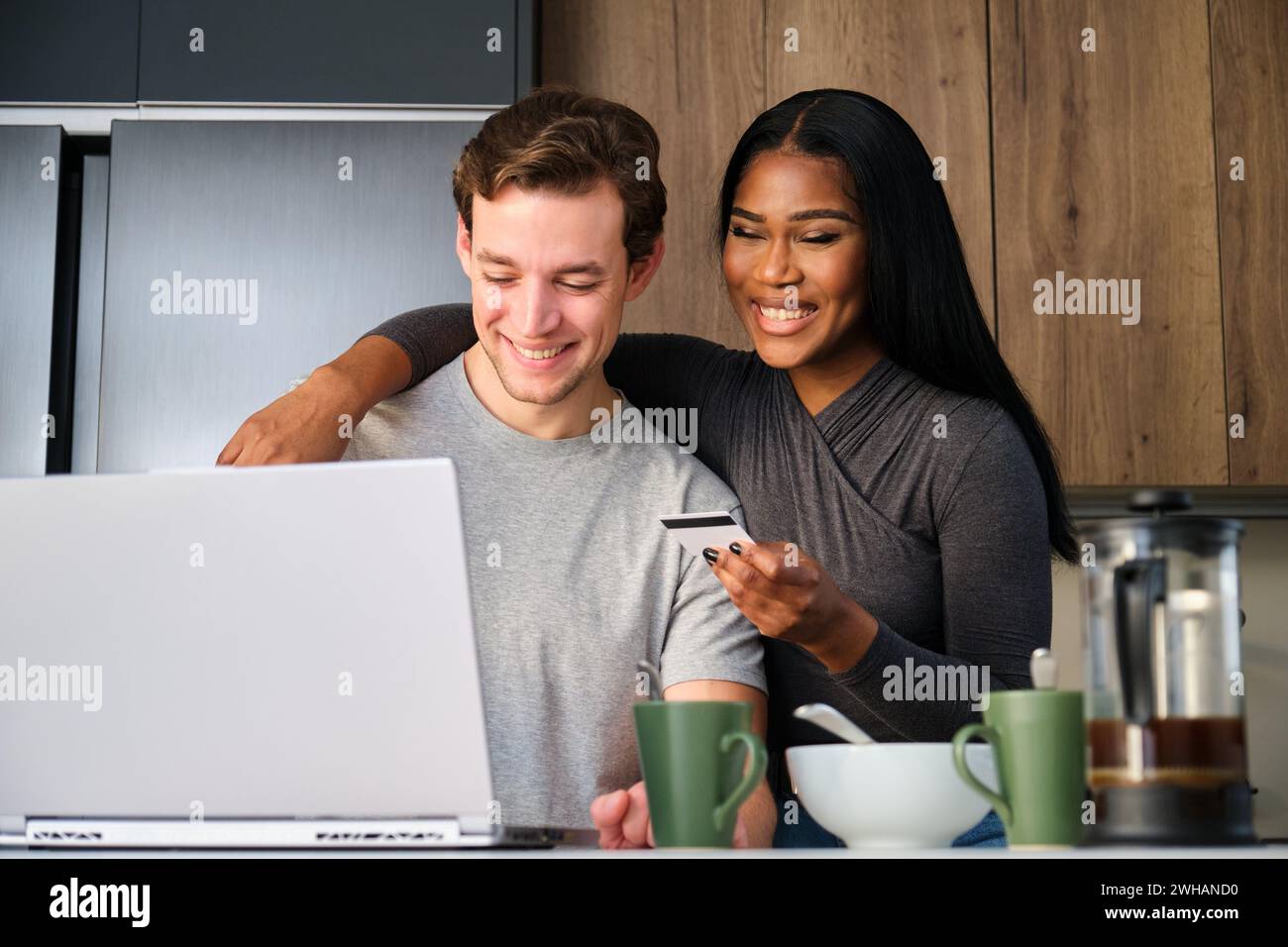 Attractive young couple shopping online hi-res stock photography and ...