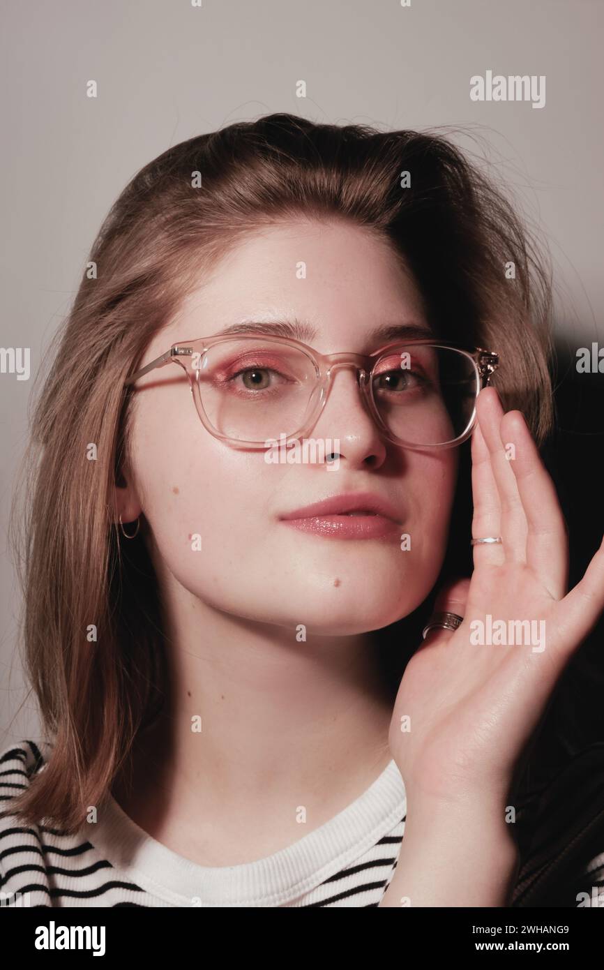 Photo of pretty charming young woman wearing glasses Stock Photo - Alamy