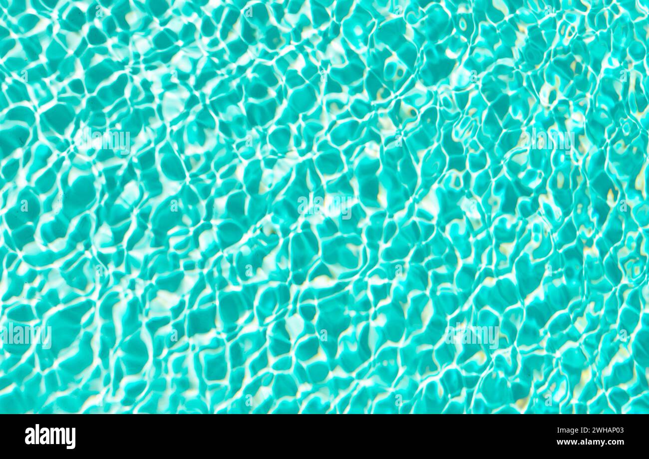 rippled water blue color in summertime swimming pool Stock Photo - Alamy