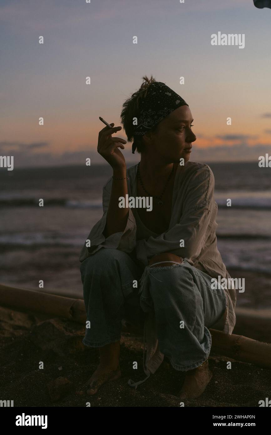Women friends hug on the shore of the ocean at sunset Stock Photo - Alamy