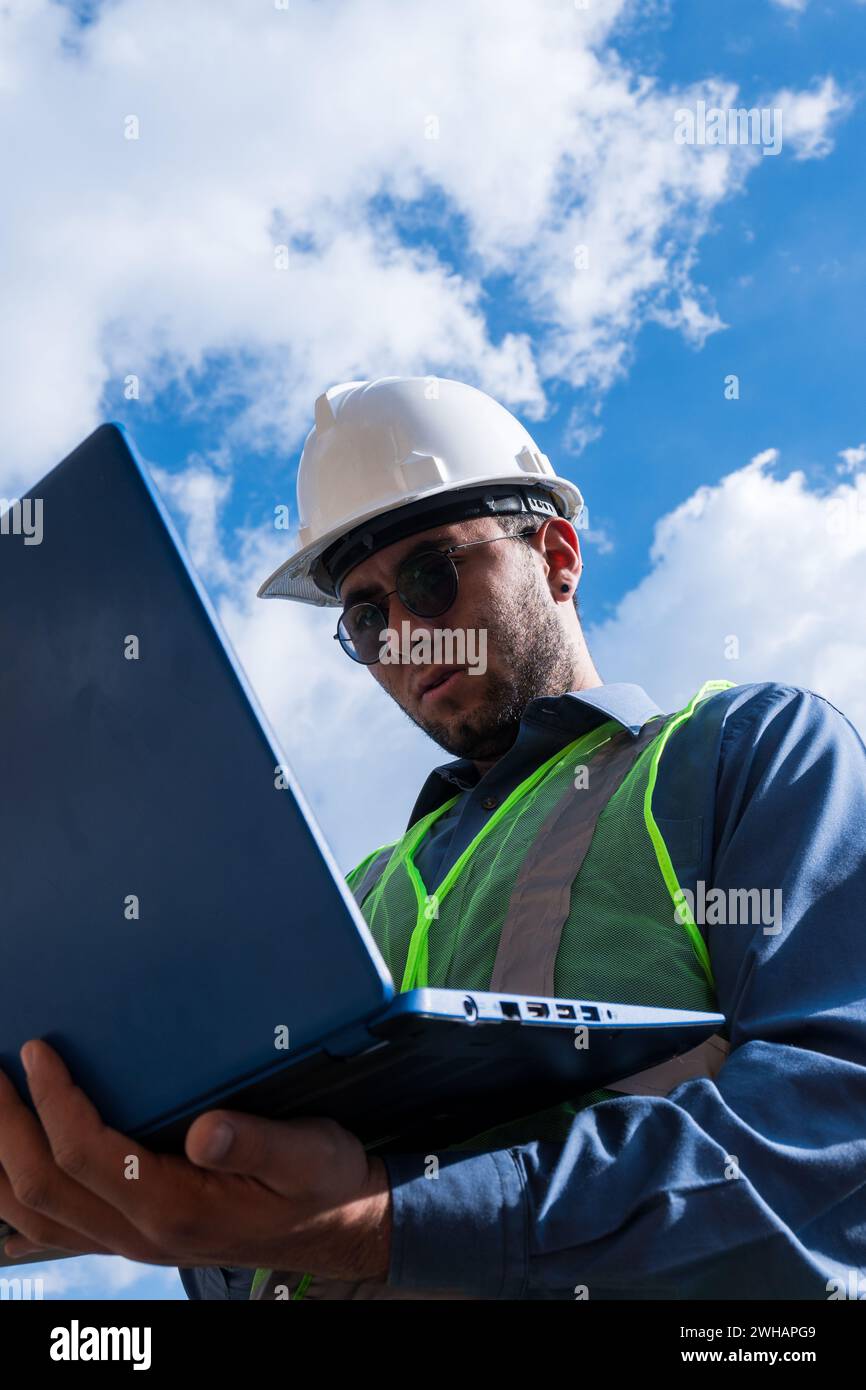 Engineer working laptop in construction hi-res stock photography and ...