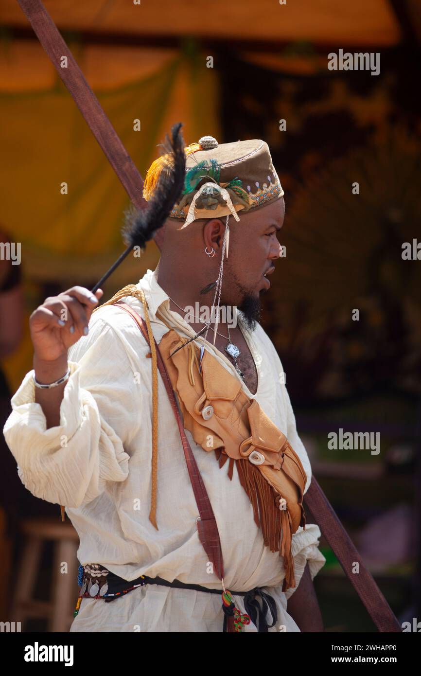 Man wearing renaissance costume holding feather vertical Stock Photo ...