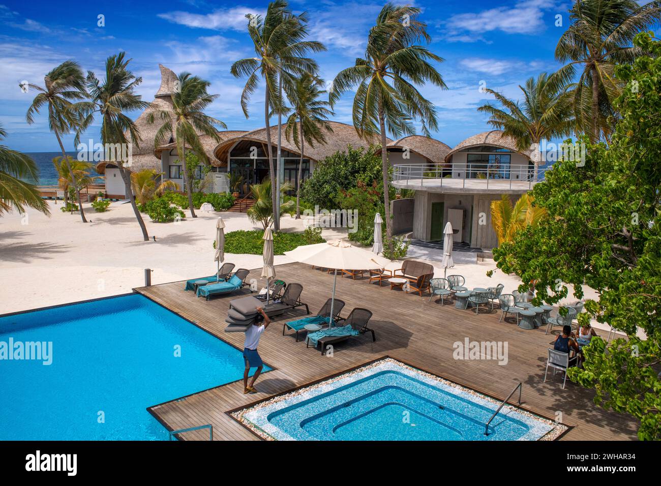 Swimming pool and restaurant of the Outrigger maldives Maafushivaru ...