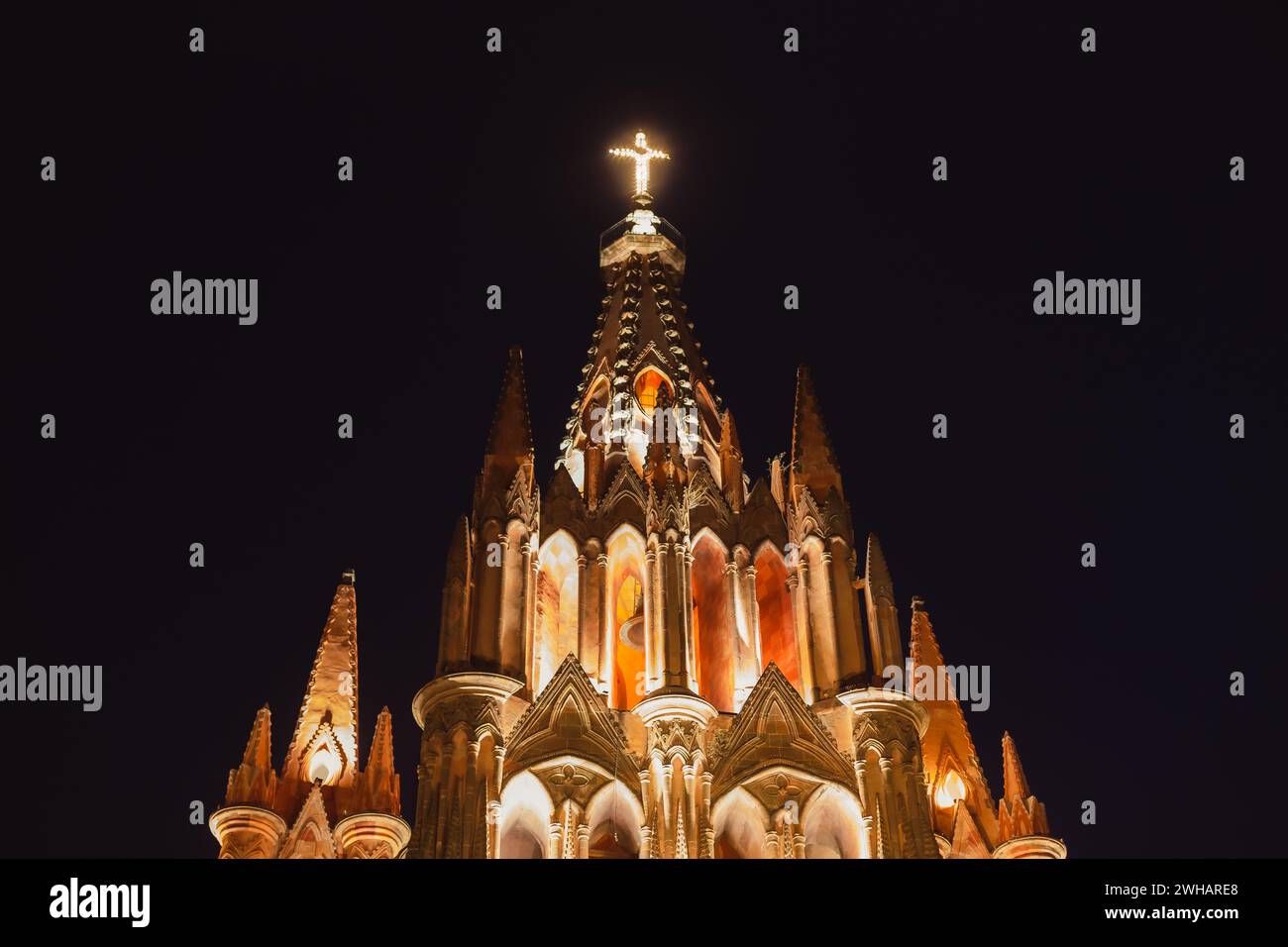 Church light up at night with illuminated cross on top Stock Photo - Alamy