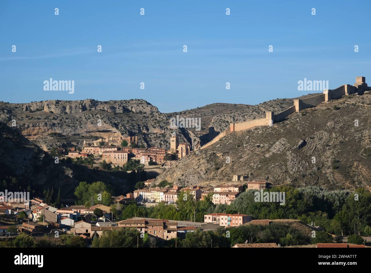 medieval walls, the Murallas de Albarracín, on the hillside surrounding ...
