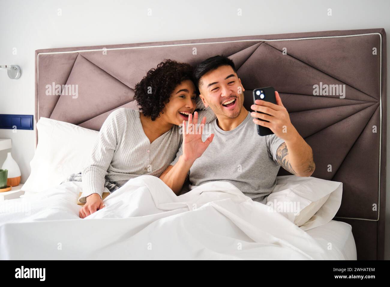 Video happy diverse couple on hi-res stock photography and images - Alamy