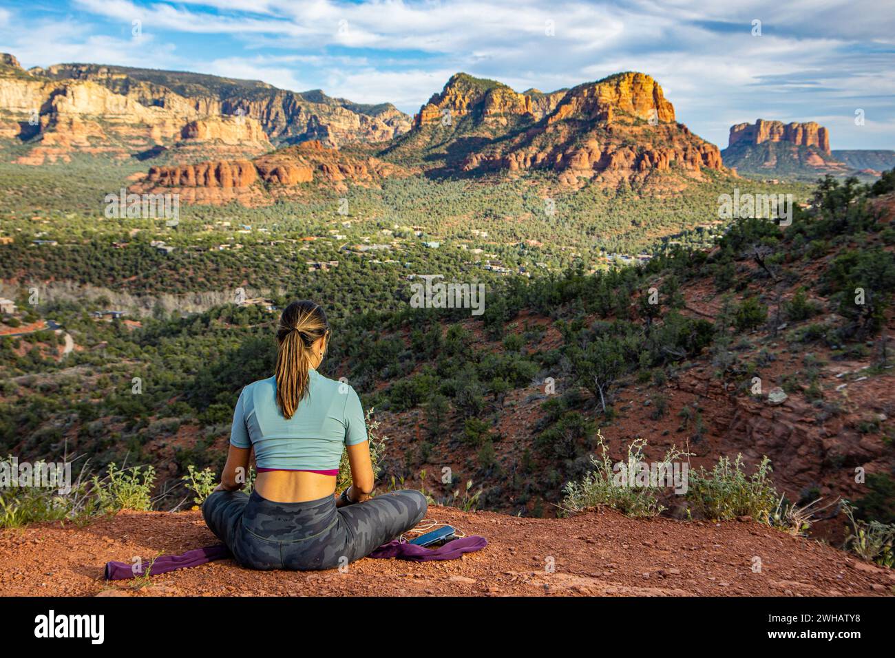 woman meditates overlooking Red rocks, Coconino National Forest, Sedona ...