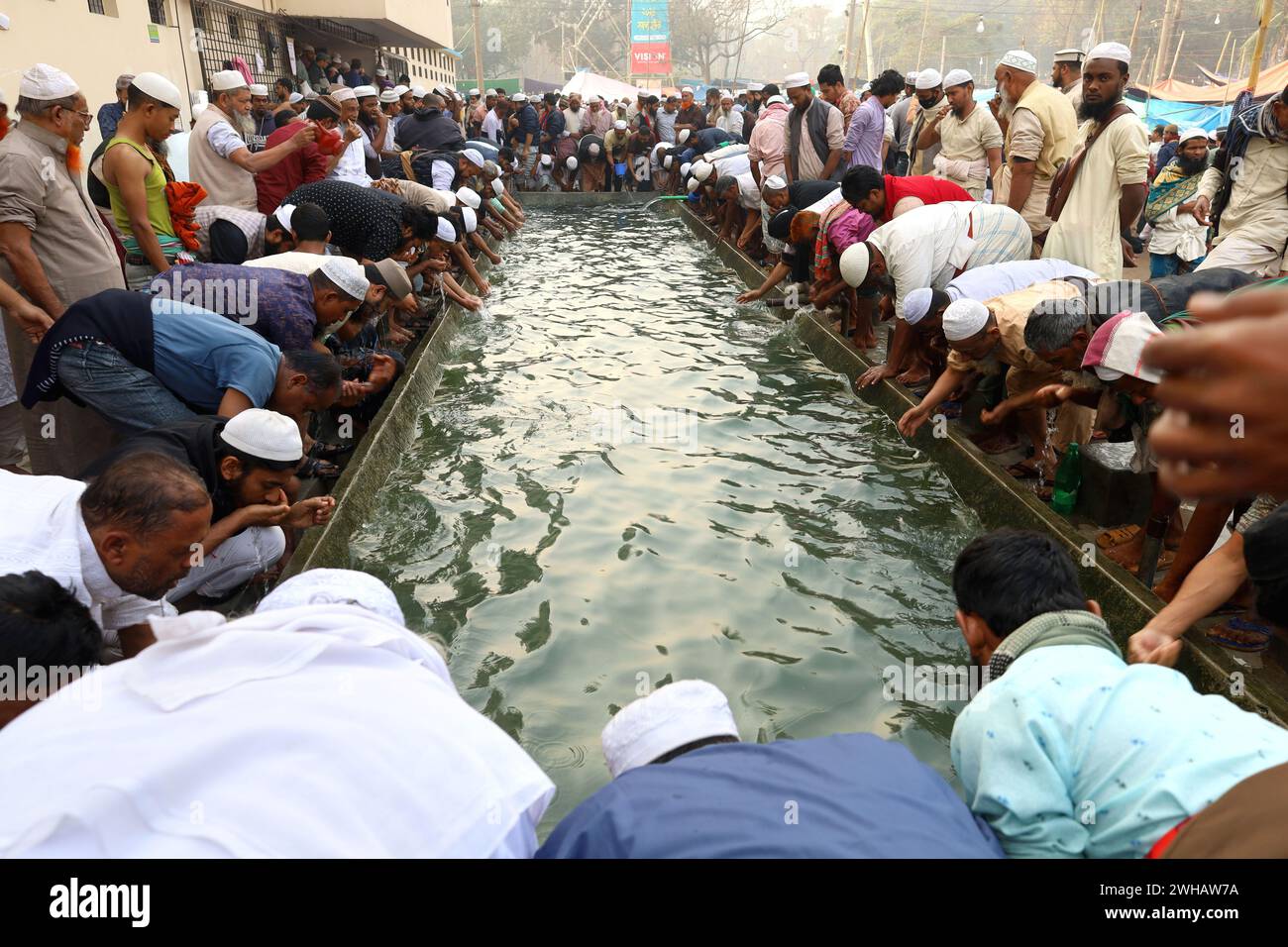 Tongi, Gazipur, Bangladesh. 9th Feb, 2024. Devotees using water from ...