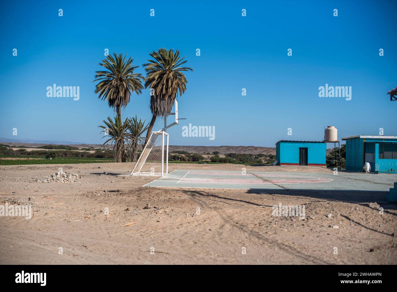 isolated and abandoned basketball court in an oasis near Nazca with ...