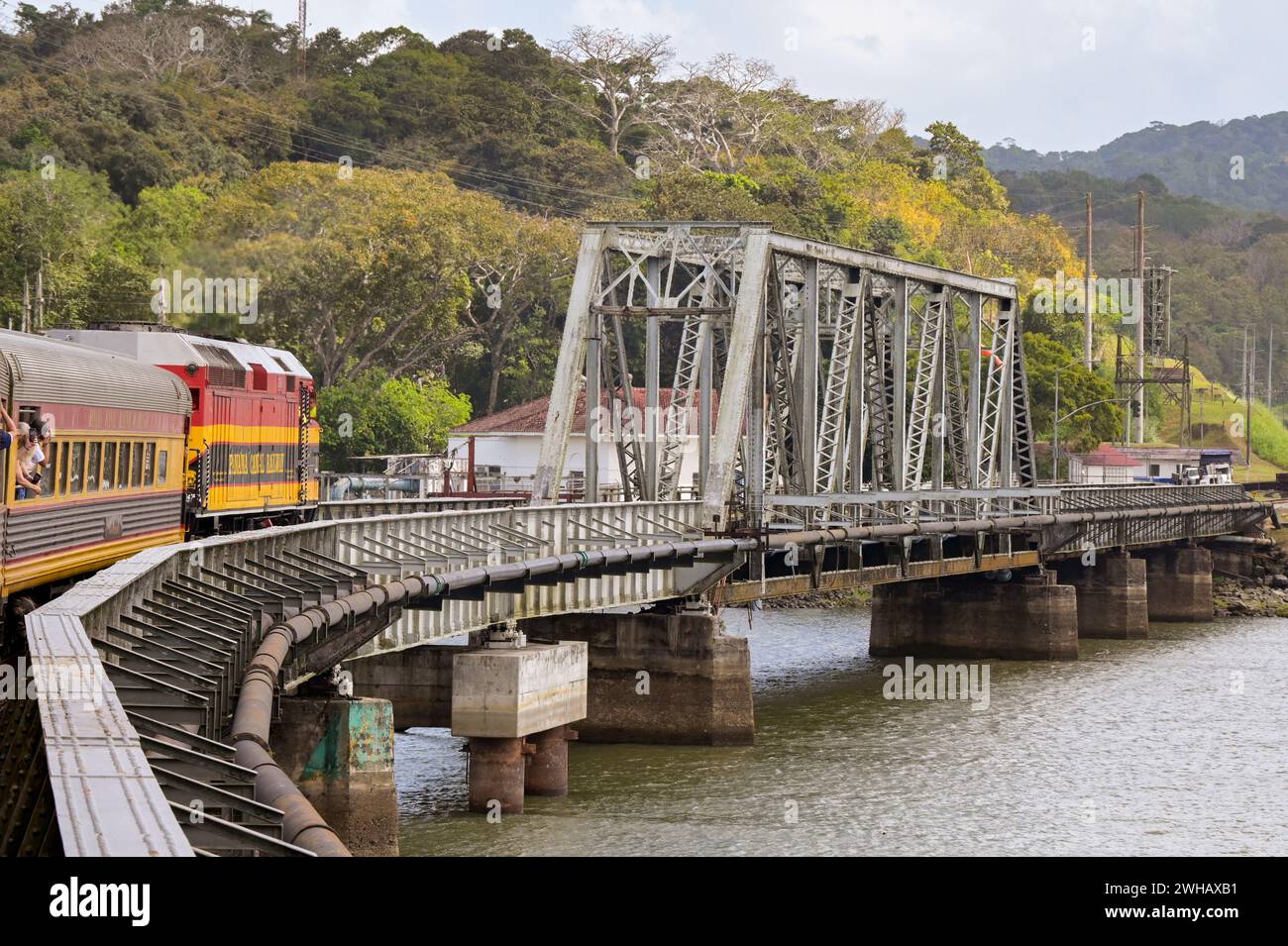 Panama - 22 January 2024: Diesel locomotive pulling coaches rounding a ...