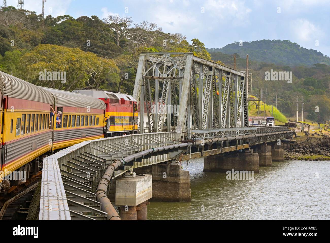 Panama - 22 January 2024: Diesel locomotive pulling coaches rounding a ...
