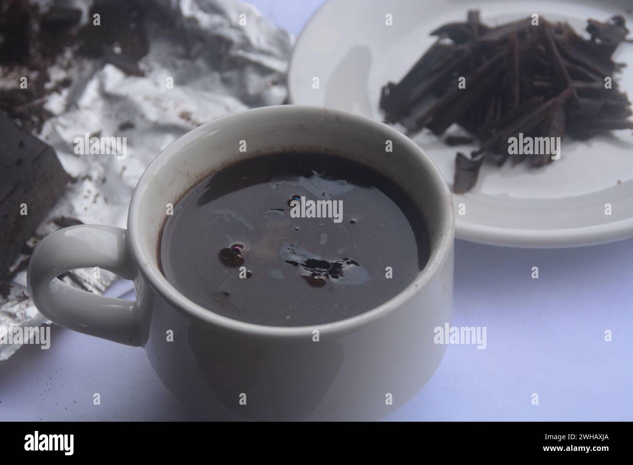 hot chocolate drink in a white cup. Its thick texture is drunk when it ...