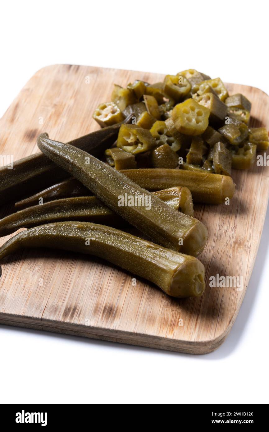 Natural Okra slices on cutting board isolated on white background Stock ...