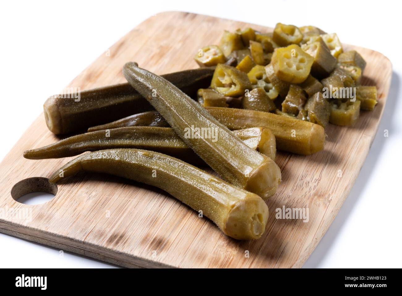 Natural Okra slices on cutting board isolated on white background Stock ...