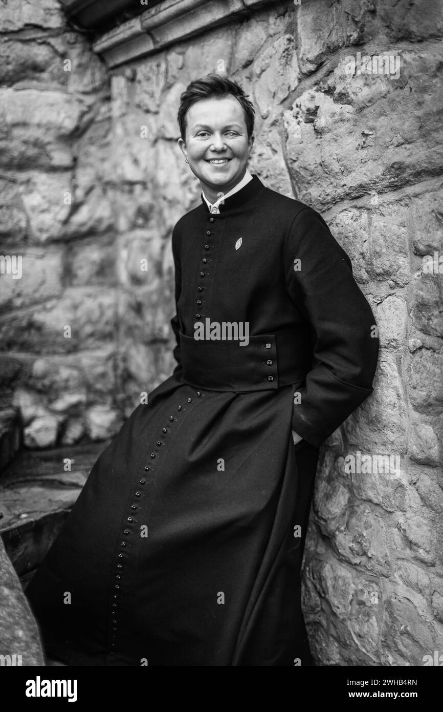A female church person poses for a portrait Stock Photo - Alamy