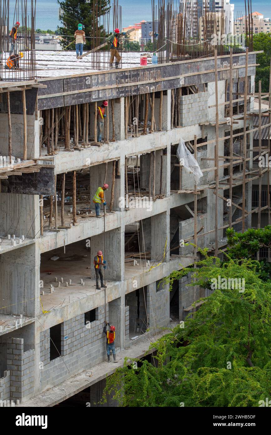Construction workers working on an apartment building in central Santo ...