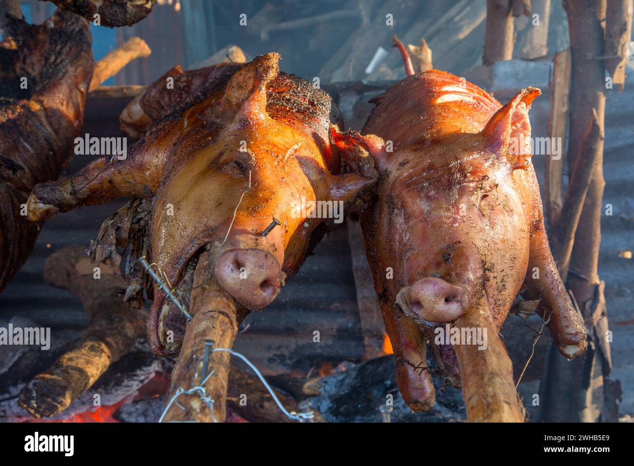 Pig cooking over open fire hi-res stock photography and images - Alamy