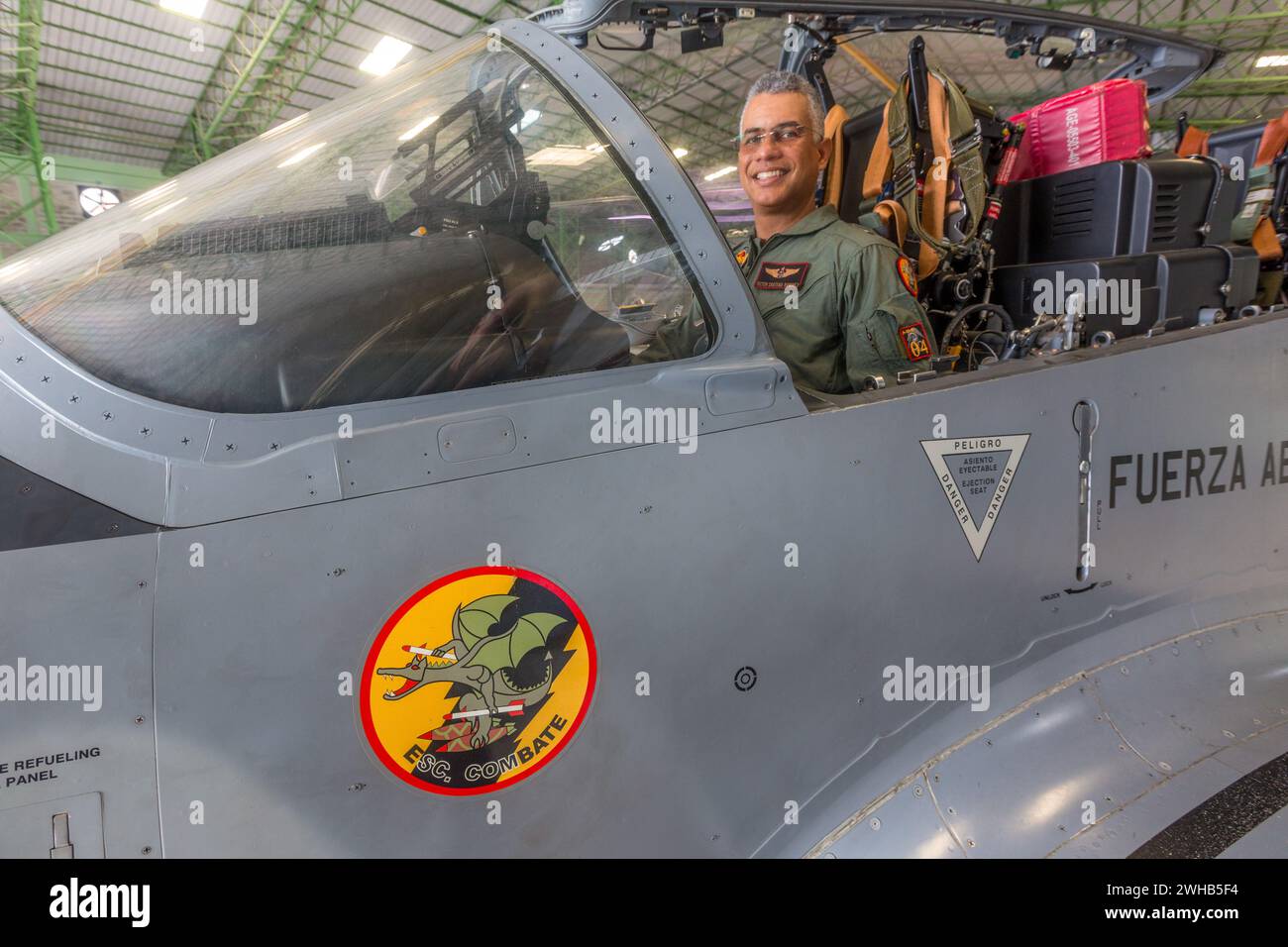 A Dominican Air Force pilot in the cockpit of a Super Tucano fighter ...