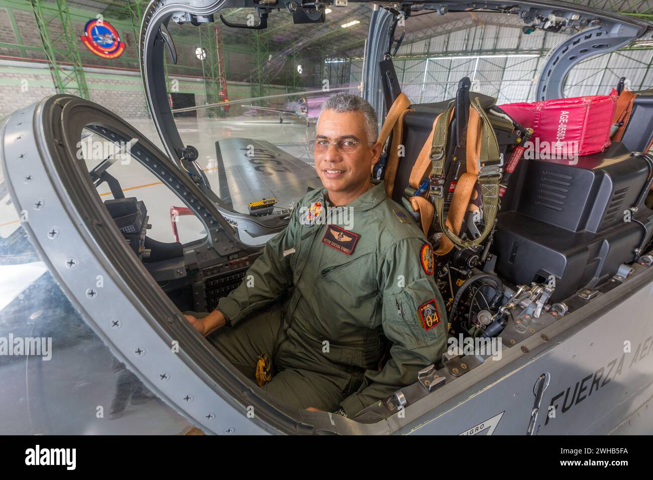 A Dominican Air Force pilot in the cockpit of a Super Tucano fighter ...