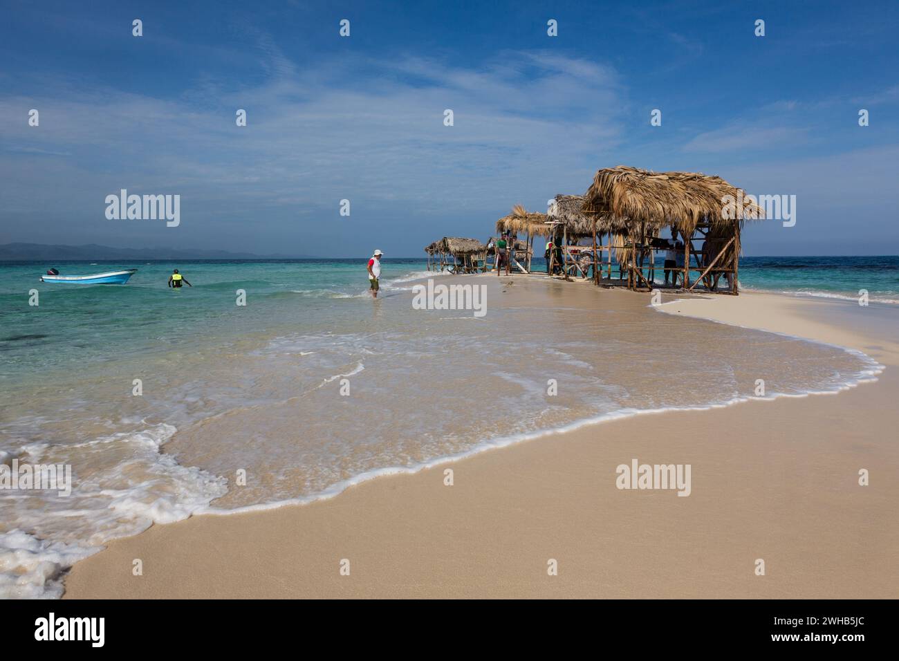 Waves break over tiny Cayo Arena or Paradise Island, a sandbar island ...