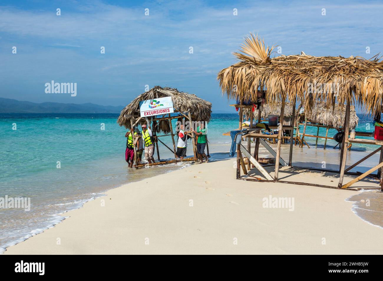 Guides move a shelter on tiny Cayo Arena or Paradise Island, a small ...