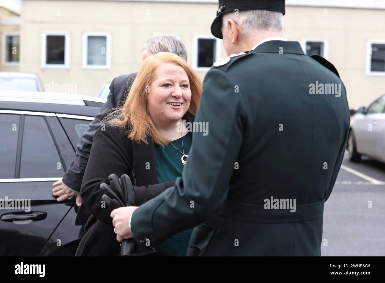 Justice minister Naomi Long shakes hands with Chief Constable Jon ...