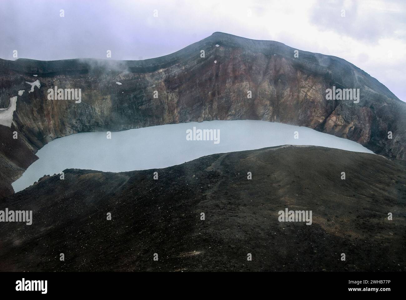 Flying over a crater lake in the Nalychevo Nature Park, Kamchatka ...