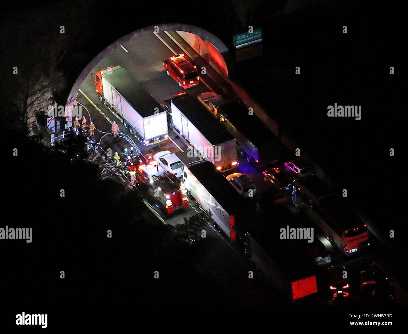 An aerial photo shows fire engines near an accident site in Shizuoka ...