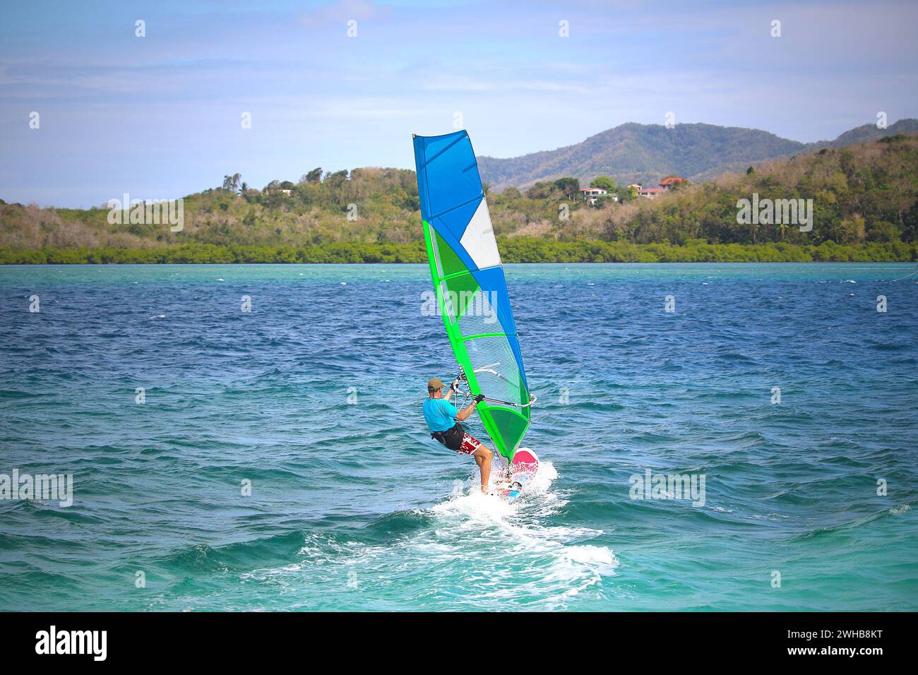 Windsurfing in the warm emerald green Caribbean water of the Bay of ...