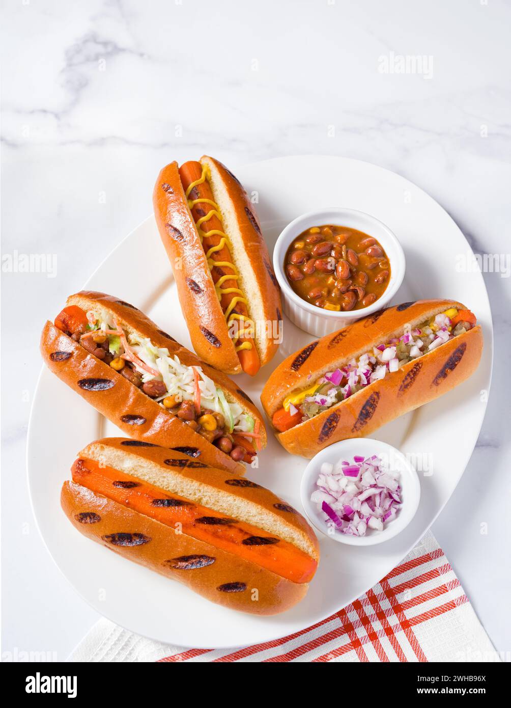 High angle view of plant-based hot dogs made from carrots with various ...