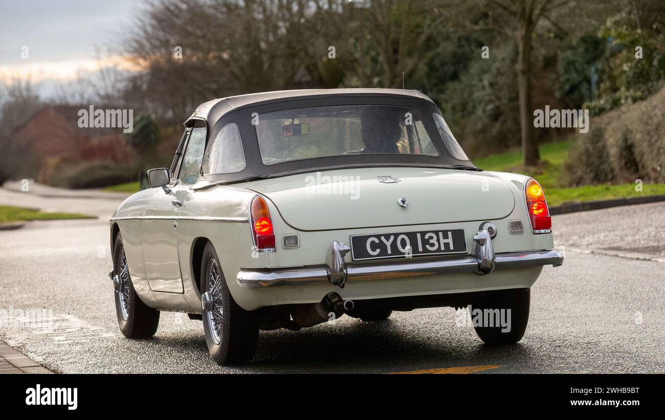 Milton Keynes,UK-Feb 4th 2024: 1969 white MGB classic car driving on an ...