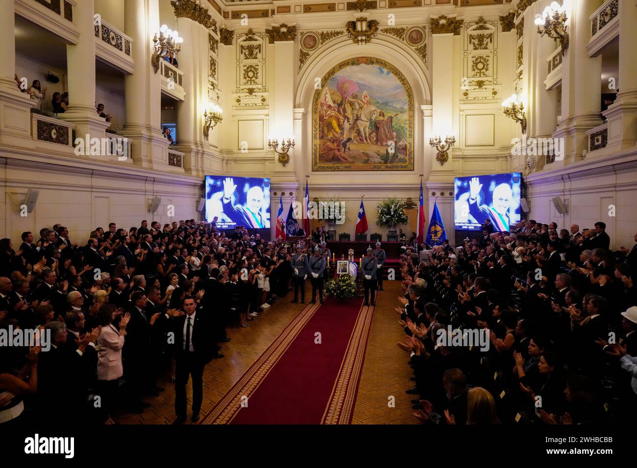 People applaud during the wake of former Chilean President Sebastian ...