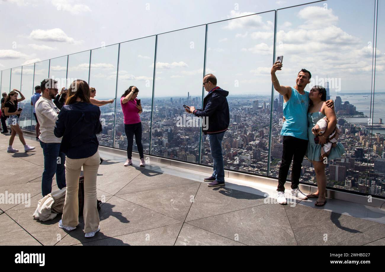 New York City: tourists taking photos at The Edge observation deck at ...