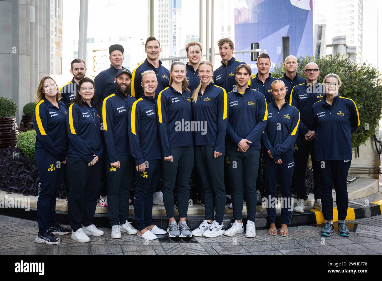 240209 Athletes and staff of the Swedish national swimming team pose ...