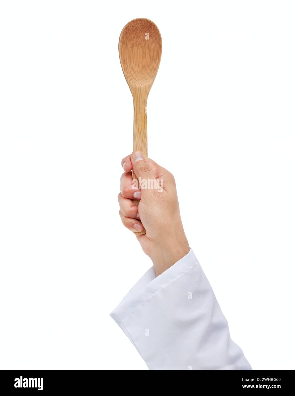 A chef arm holding wood spoon with white background Stock Photo - Alamy