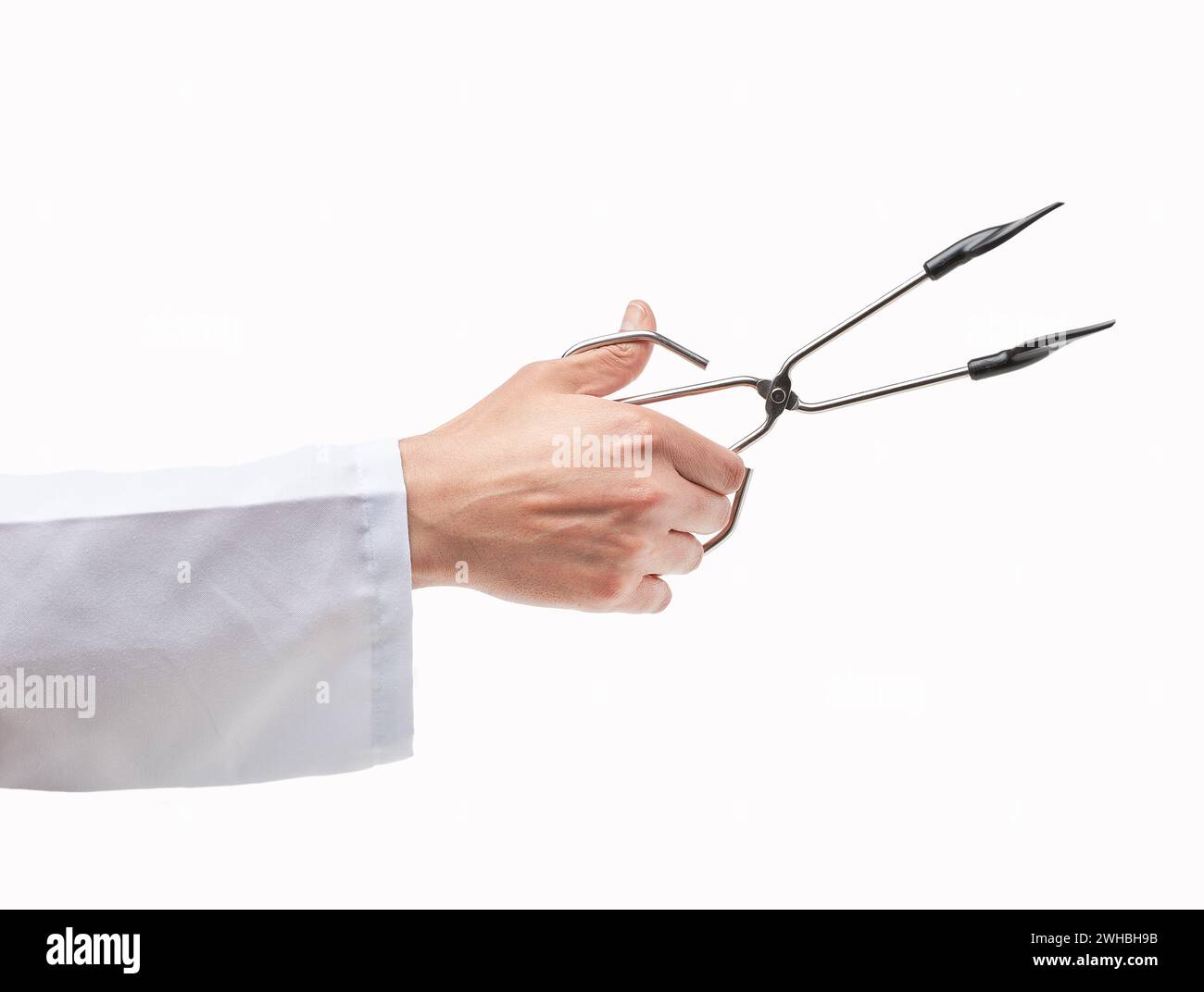 Man hand using an opened kitchen tongs isolated on a white background ...