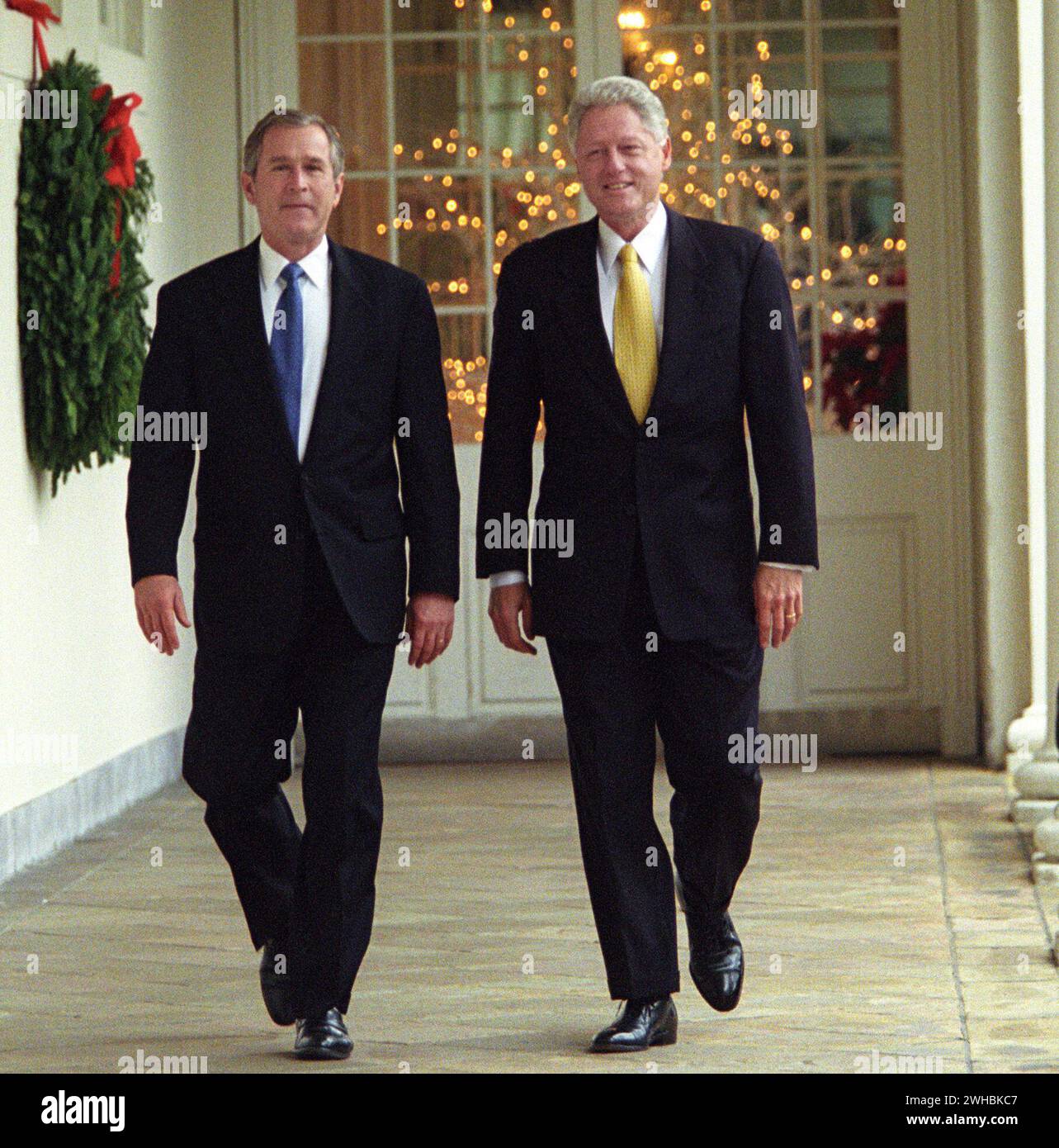 President Bill Clinton and President-Elect George W. Bush walk along ...
