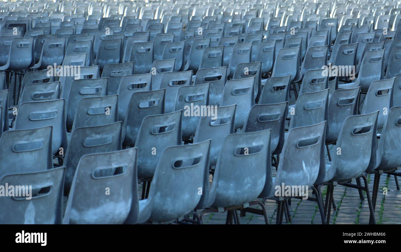 symmetrically placed plastic chairs for an event or celebration. crowd ... symmetrically placed plastic chairs for an event or celebration. crowd ...