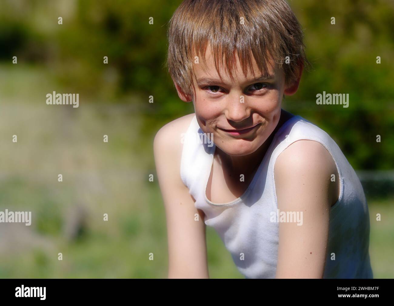 Boy looking at camera Stock Photo - Alamy