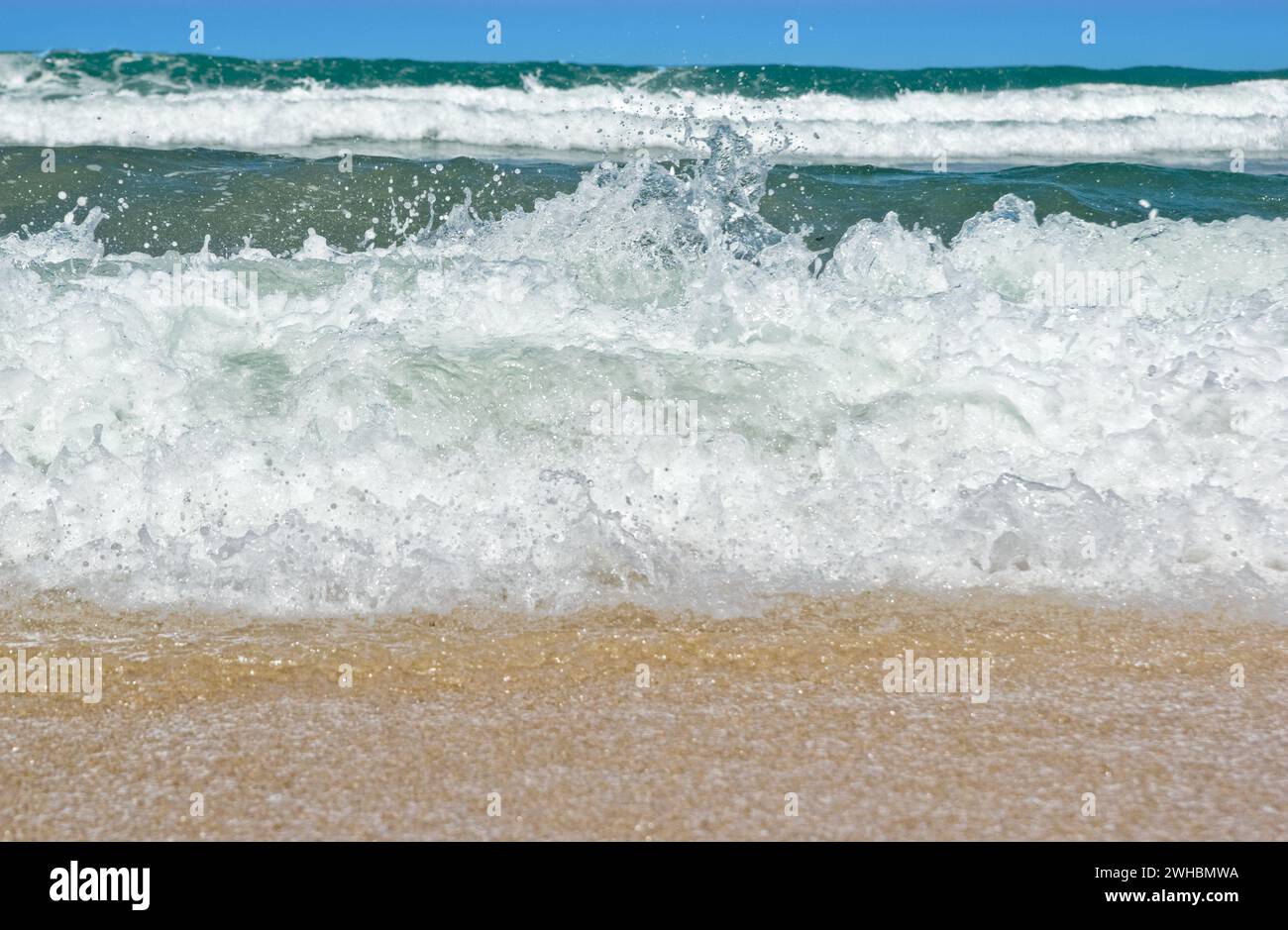 Waves on the beach Stock Photo - Alamy