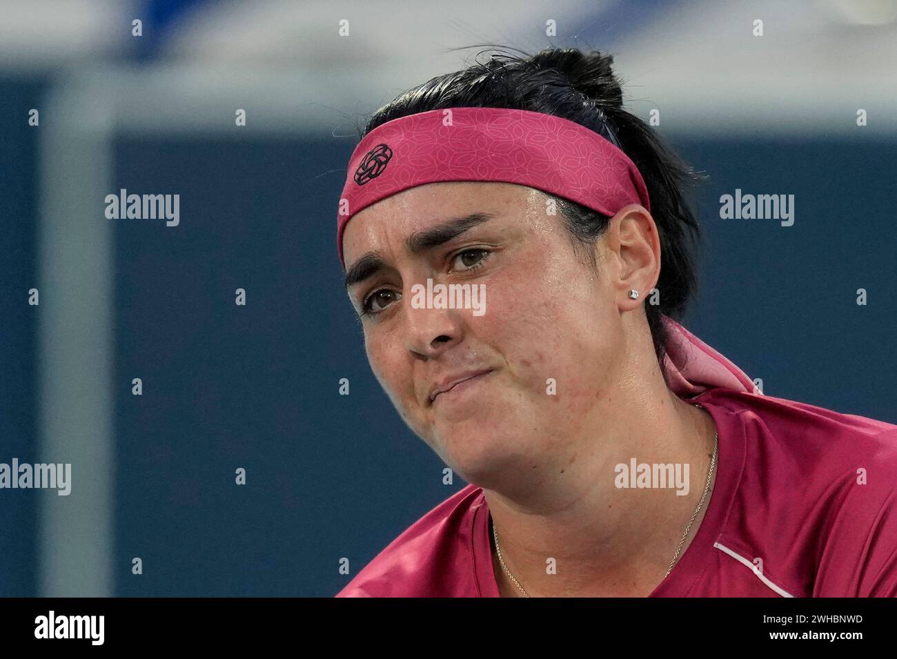 Ons Jabeur of Tunisia reacts after losing a point against Beatriz Haddad Maia of Brazil during a ...