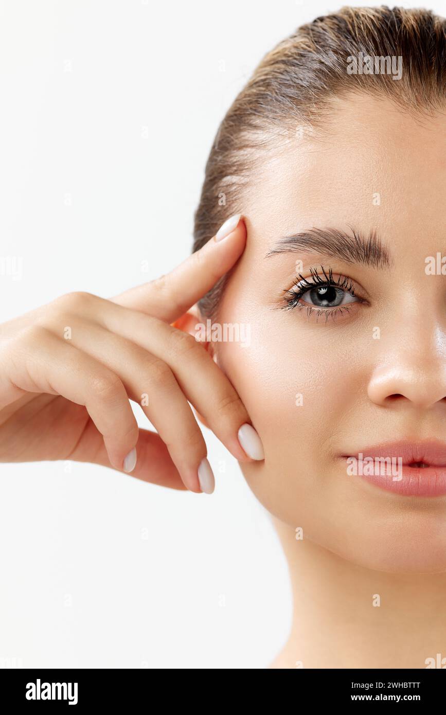 Half-faced portrait of beautiful young woman with clear face, long ...