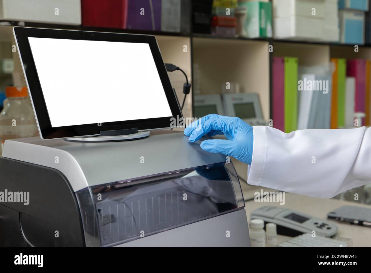 Doctor reviewing patient data on touchscreen monitor Stock Photo - Alamy