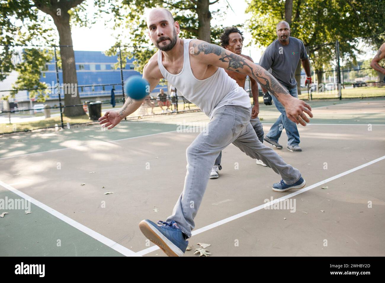A group of men play a game of American Handball or wallball in ...
